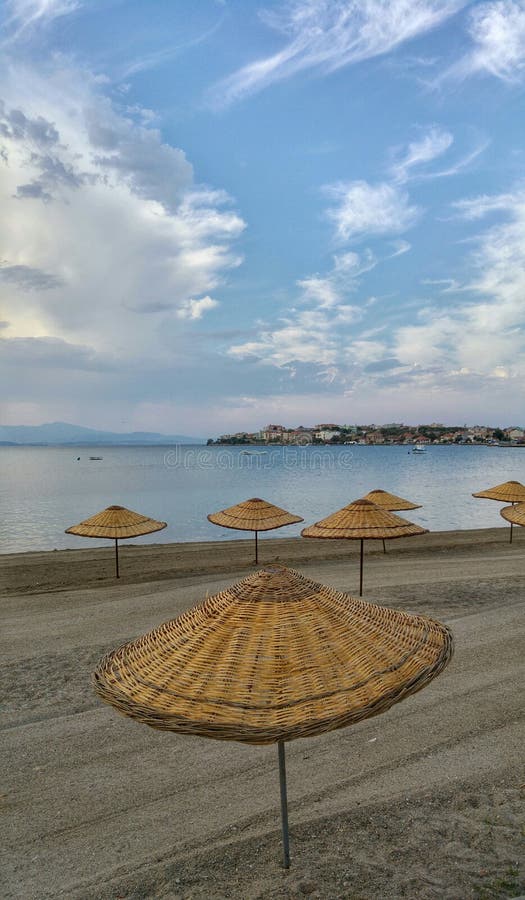 Calm Beach with Dunes and Green Grass. Tranquil Ocean Stock Image ...