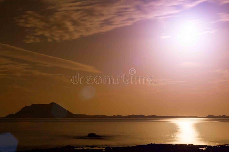 Calm Beach Sunset with Serene Reflection on Peaceful Water Stock Photo ...