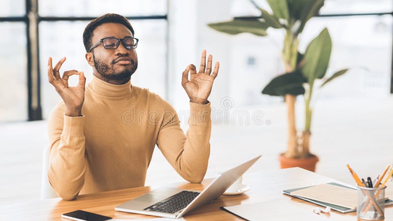Calm Black Guy Meditating while Doing Homework Stock Photo - Image of ...