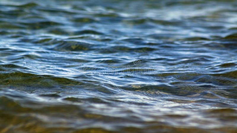 Calm Blue Lake Waters with Soft Rippling on Surface Stock Image - Image ...