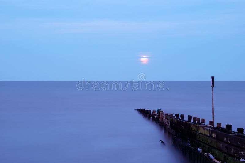 Calm blue sea stock photo. Image of groyne, moonlight - 12240242