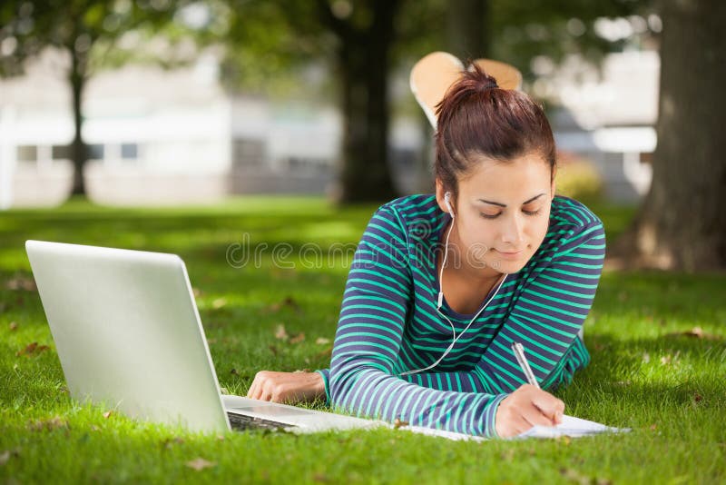 Calm Student Holding a Book while Sitting Stock Photo - Image of ...