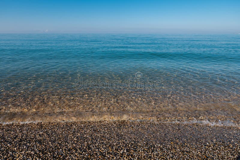 Calm Clear Sea, Pebble Shore, Flat Horizon Stock Photo - Image of ...