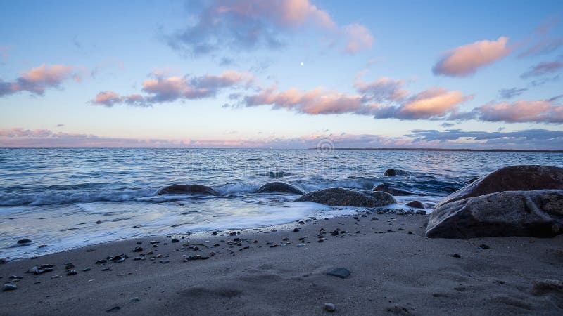 Calm Empty Sand Beach with Big Rocks at Sunset Stock Photo - Image of ...