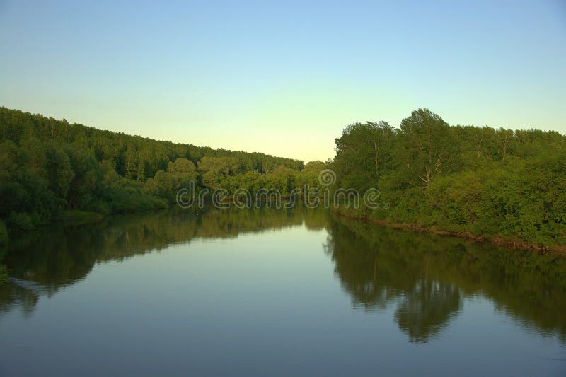 Calm Forest Lake at Sunset with Reflection of Forest and Sky. Landscape ...