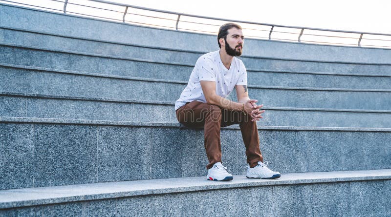 Calm Guy in Casual Style Sits Pensive. Lonely Man on Steps Stock Image ...