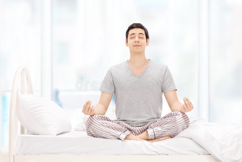 Calm Guy Meditating Seated on Bed Stock Photo - Image of joyful, happy ...