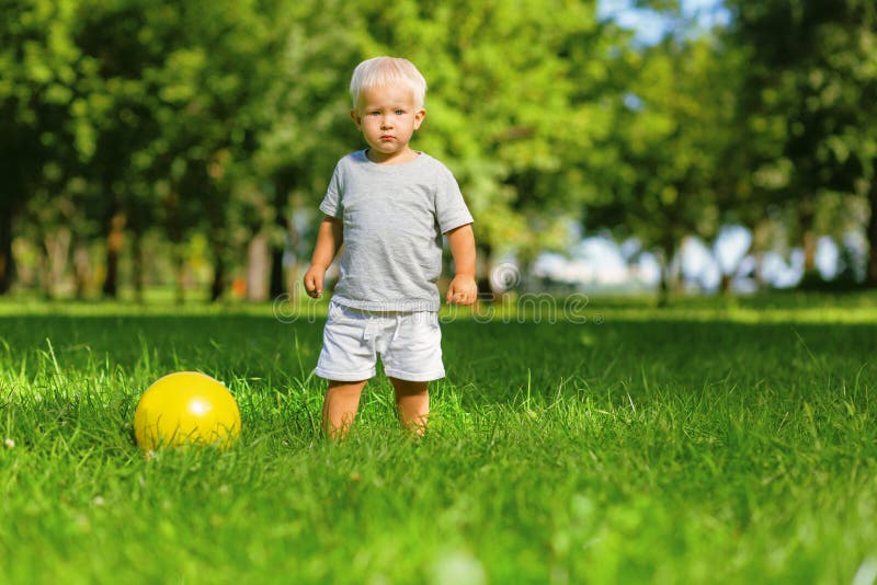 Calm Kid Playing with the Ball Outside Stock Photo - Image of happy ...