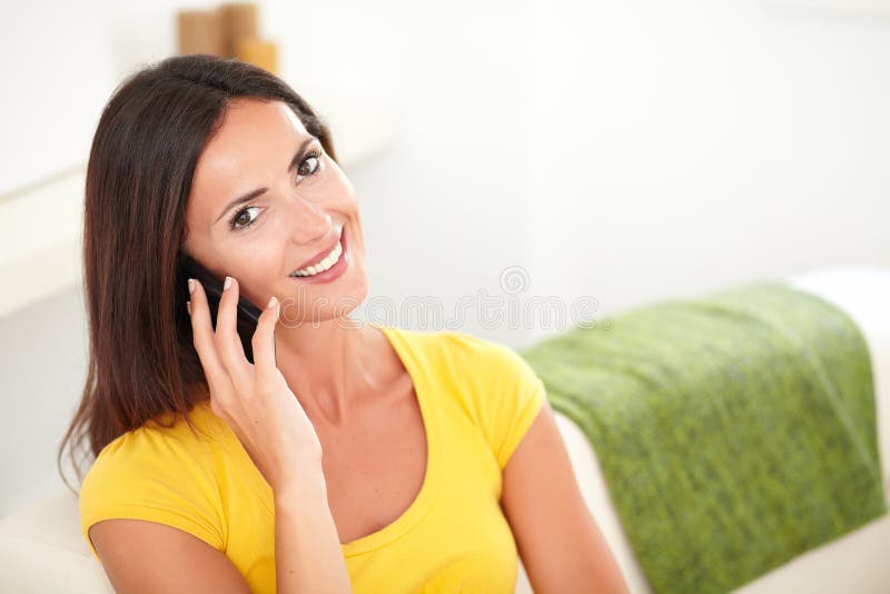 Calm Lady Smiling while Talking on Her Cell Phone Stock Photo - Image ...