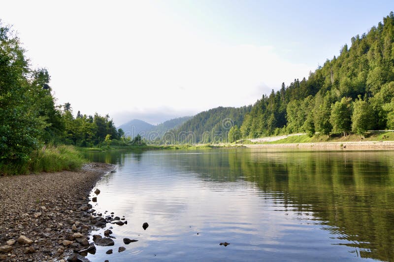 Calm Lake in the Mountain with Tree Reflection on Water Surface Stock ...