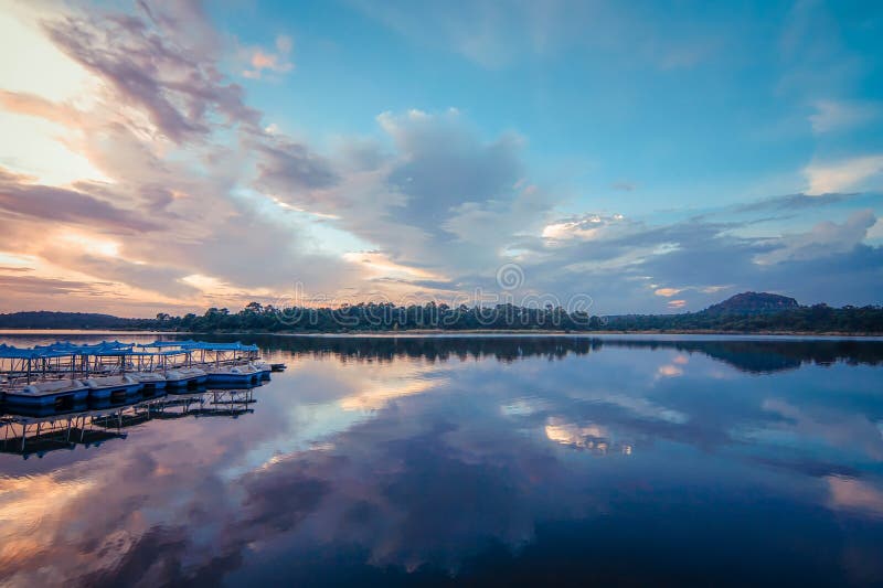 Lakeside at dusk stock illustration. Illustration of cloud - 367557410