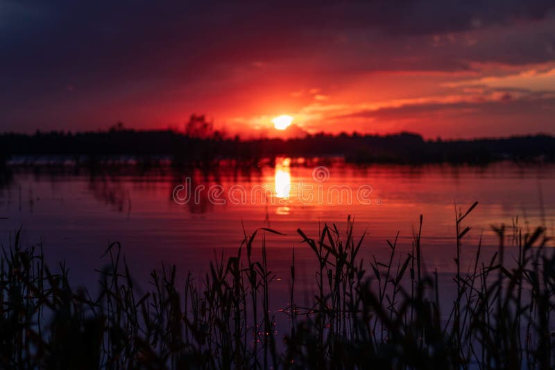 Calm Lake Sunset Reflection Stock Photo - Image of sunset, reflection ...