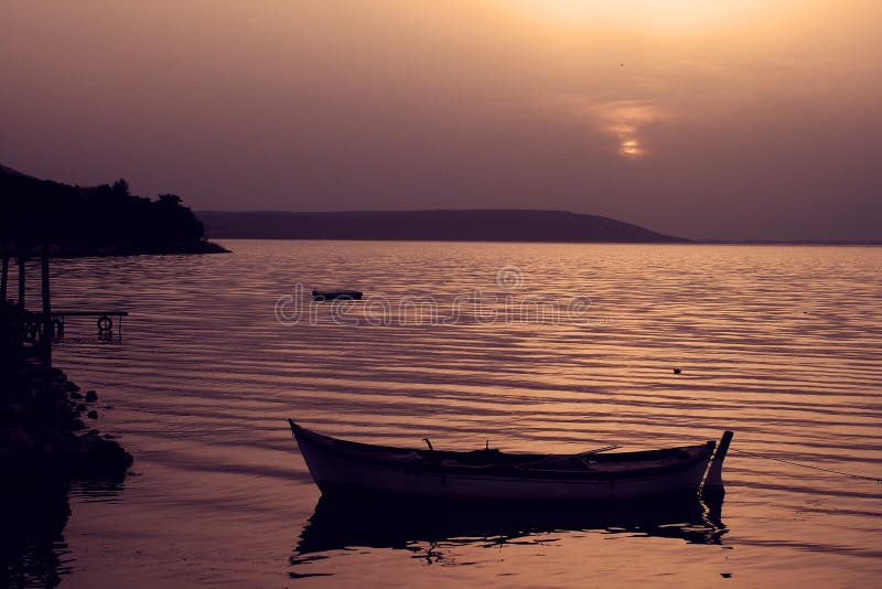 Calm Landscape with a Lake and Sunset and a Boat Stock Photo - Image of ...