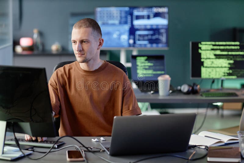 Calm Male Programmer Coding on Computer Working Alone at Desk with ...