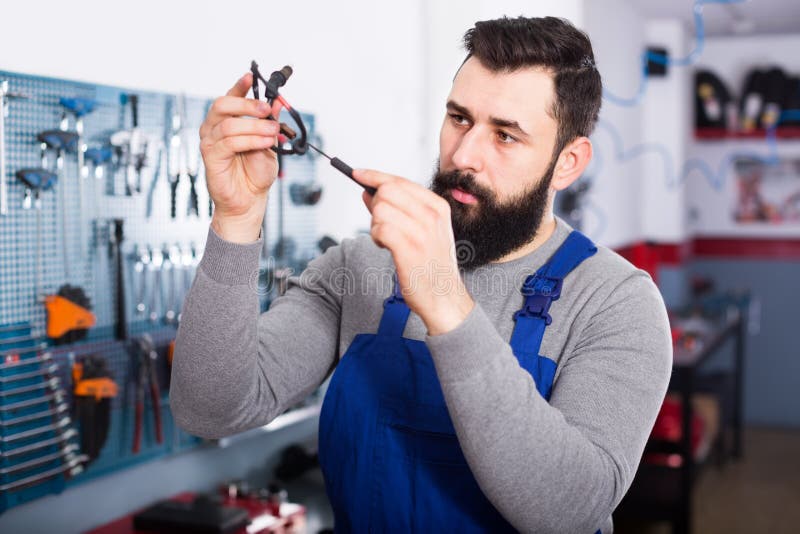 Calm Man Worker Working at Restoring Motorbike in Workshop Stock Image ...