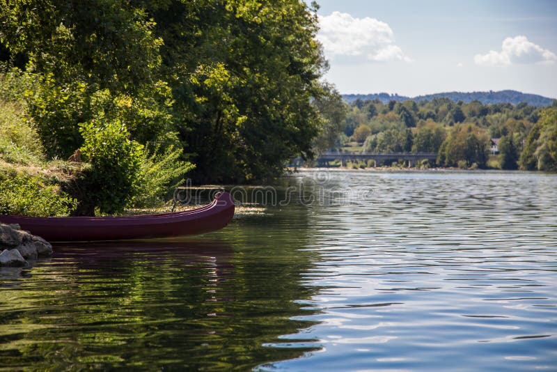 Calm Pond with a Canoe Near a Forest Stock Photo - Image of outdoor ...