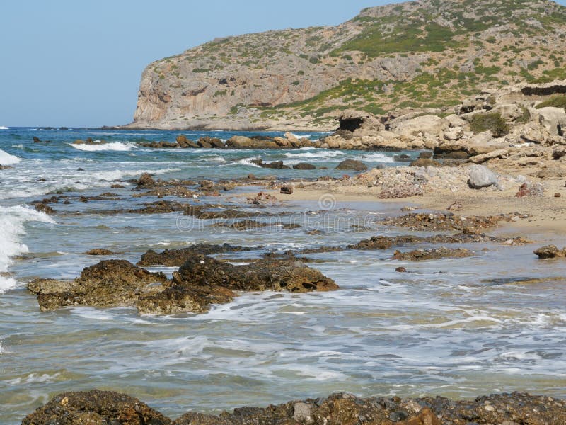Calm Rocky Beach Captured on a Sunny Day in Crete, Greece Stock Photo ...