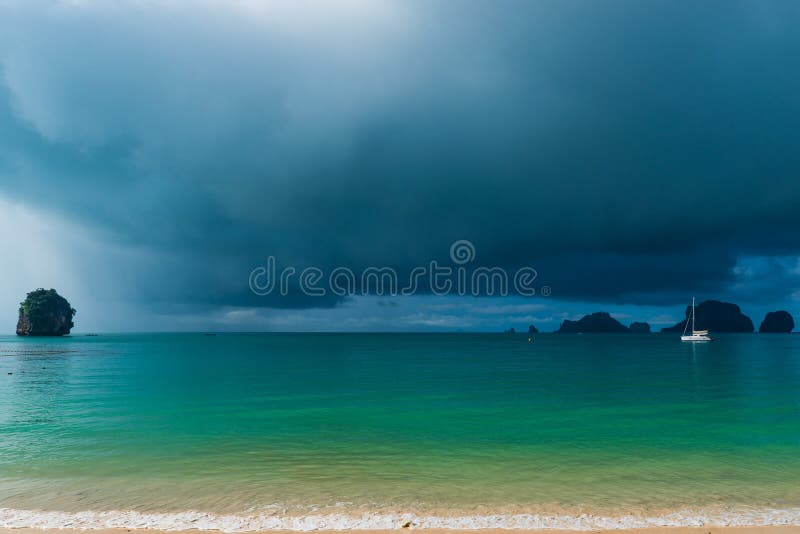 Calm Sea and Rain Clouds in Front of a Tropical Rain Stock Photo ...