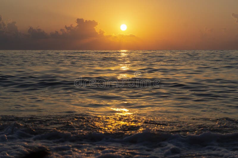 Calm Sea, Sun Setting, Light Waves. Stock Photo - Image of lights ...
