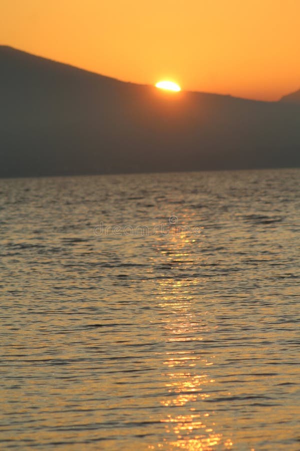 Calm Sea Surrounded Mountains Gleaming Shining Sunset Stock Photo ...