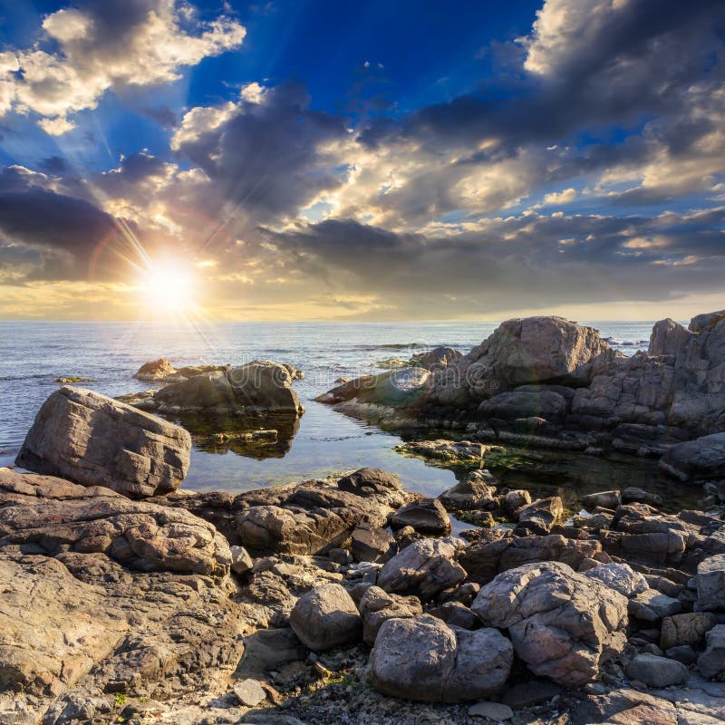 Calm Sea Wave on Rocky Shore at Sunset Stock Photo - Image of sunset ...