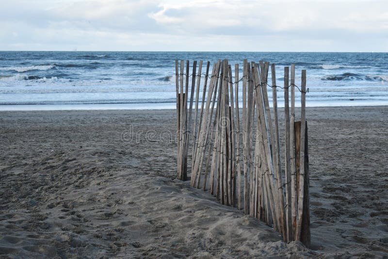 Calm see stock photo. Image of water, fence, wood, beach - 138985820
