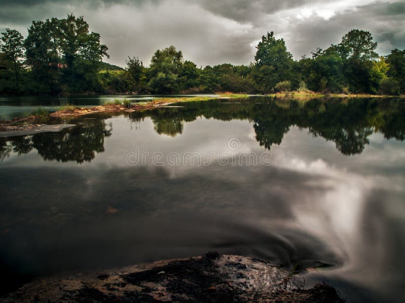 Calm and Smooth River on a Cloudy Day Stock Image - Image of water ...