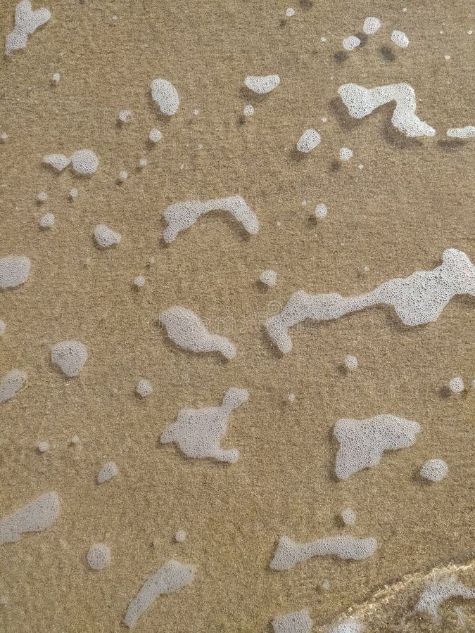 Calm Sparse Sea Foam Floating Over Clear Water Stock Photo - Image of ...