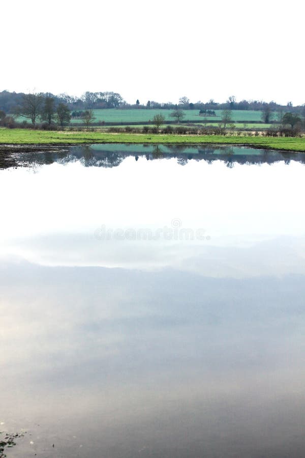 Calm still water landscape stock photo. Image of reflection - 64985774