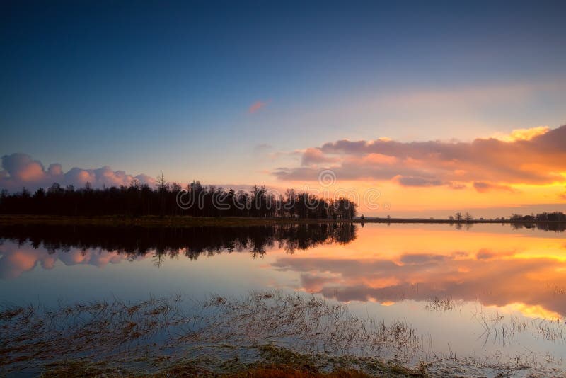 Calm Sunset Over Lake Surface Stock Photo - Image of surface, lake ...