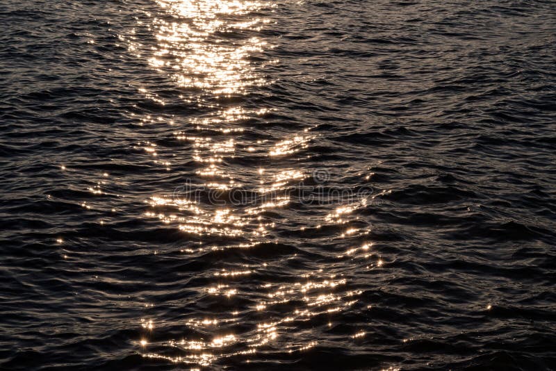 Calm Water with the Reflection of the Sun on Its Surface Stock Photo ...
