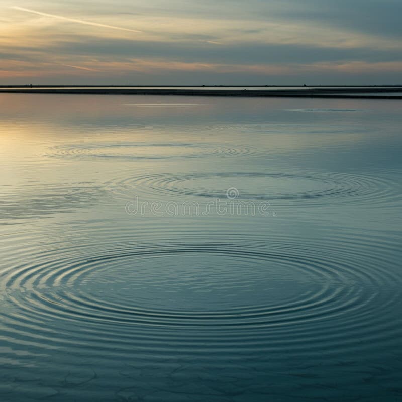 Calm Water Surface with Concentric Ripples Extending Outward, Creating ...