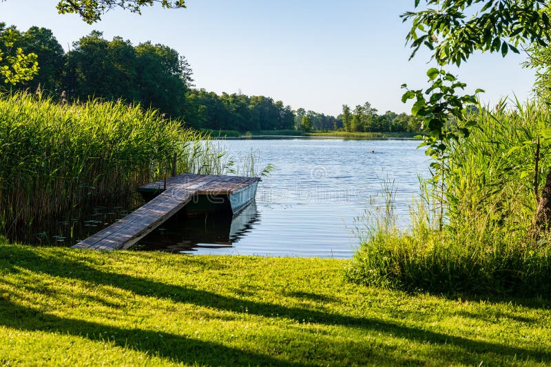 Calm Weather Sunset on Country Lake Stock Image - Image of grass, pool ...