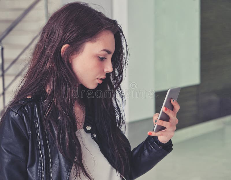 Calm Woman Using Cellphone Indoors. Stock Photo - Image of browsing ...