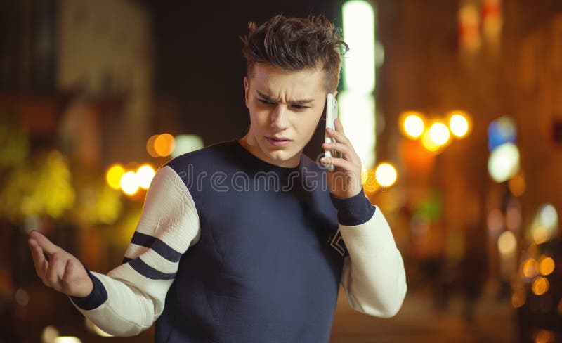 Calm Young Man Talking on the Phone Stock Image - Image of blurry ...