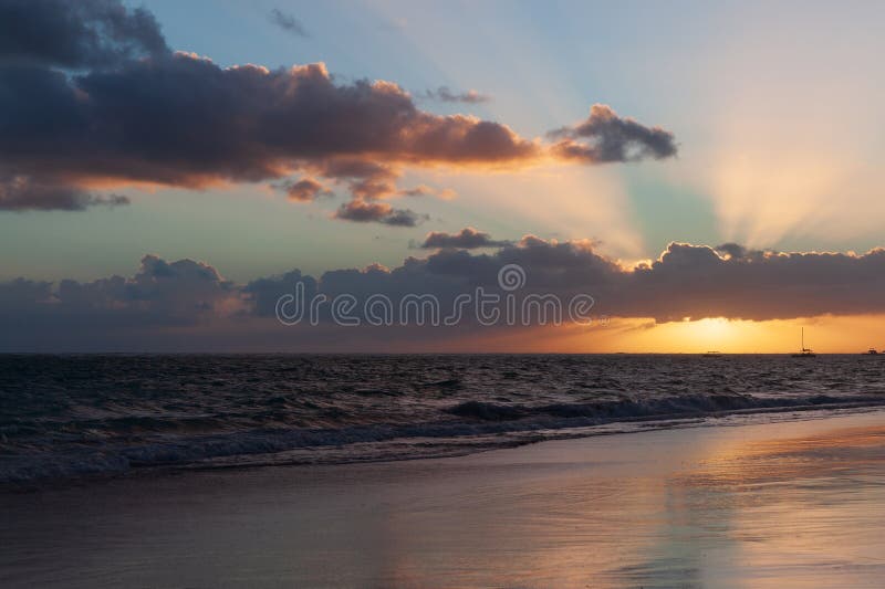 A Calming Ocean Scene during Sunset with Vibrant Sun Rays Stock Photo ...