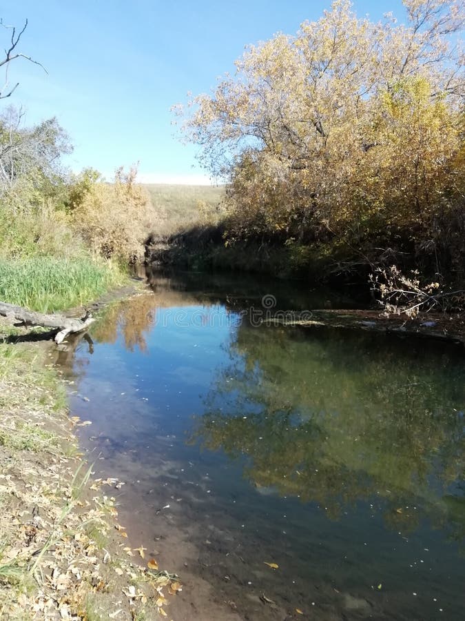 Calmly Flowing River with Mountains in Background Stock Photo - Image ...