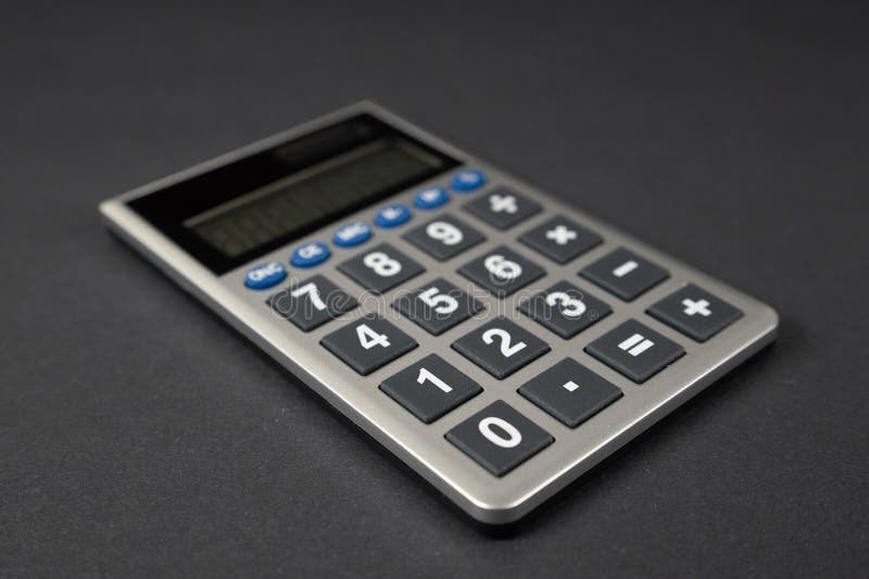 A Calculator Isolated on a Black Desk Angled Left To Right Stock Image ...
