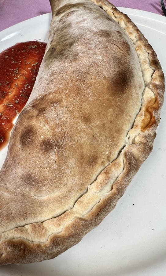 Calzone stock photo. Image of filled, meal, cooked, calzone - 275565806