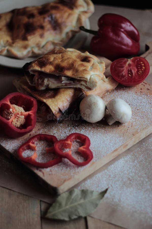 Calzone with Vegetables on a Dark Background Stock Image - Image of ...