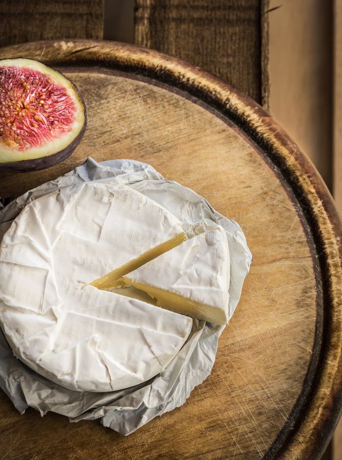Camembert Cheese on Old Wooden Board Stock Image - Image of piece, ripe ...