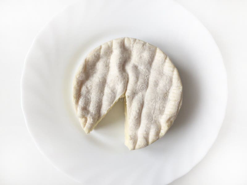 Camembert Cut on the White Plate Stock Photo - Image of cuisine, plate ...