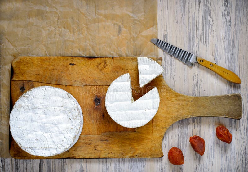 Camembert on a Wooden Cutting Board. Stock Photo - Image of dinner ...