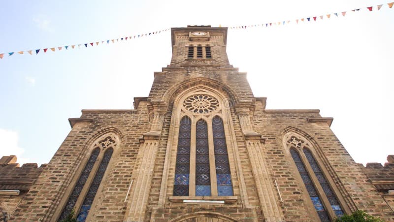 Camera Approaches Front Wall at Backlight of Catholic Church Stock ...