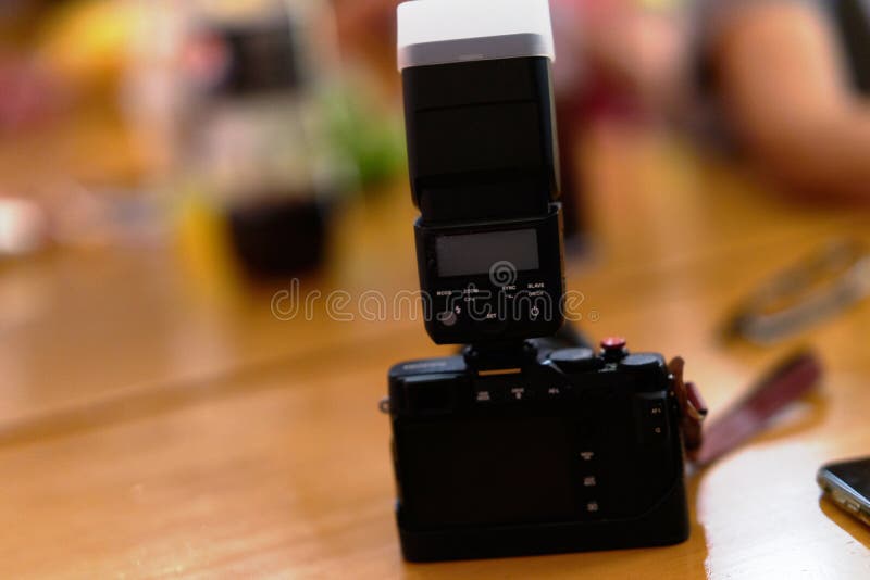 Camera Attached Flash Light with Soft Box Cover on Table Party ...