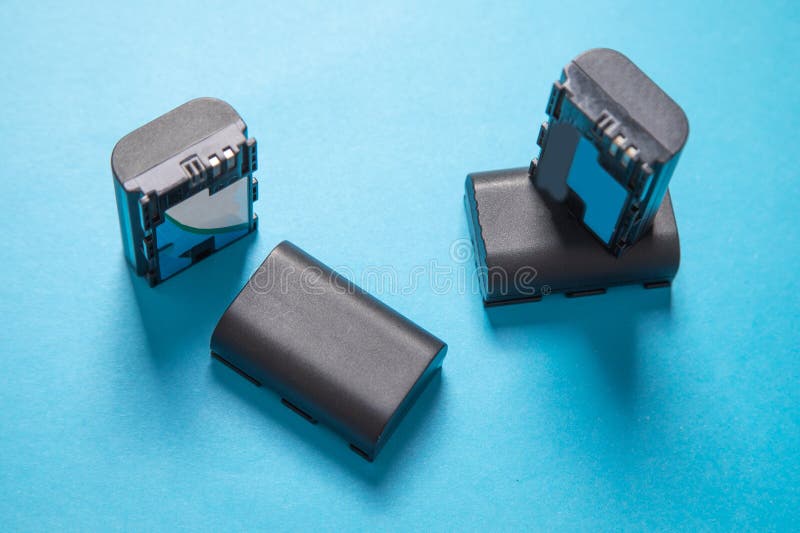Camera Batteries on the Blue Background Stock Illustration ...