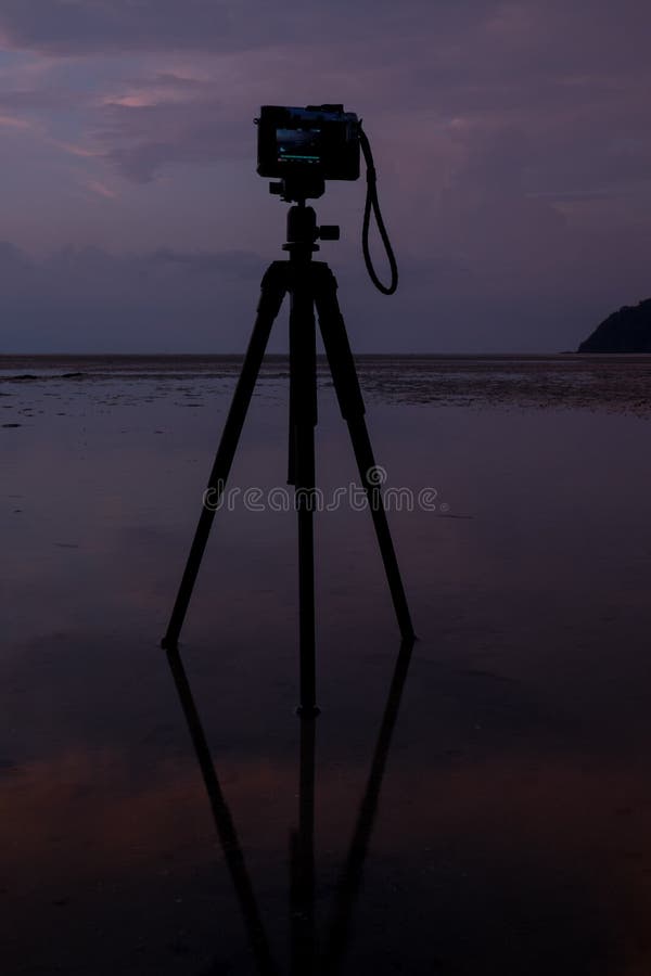 Camera on the Beach with Reflection in Water during Sunset. Stock Photo ...