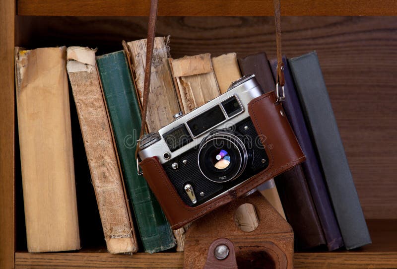 Camera and books stock image. Image of antique, prose - 38763425