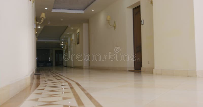 Camera Changes the Angle from Illuminated Side of Corridor Deep into ...