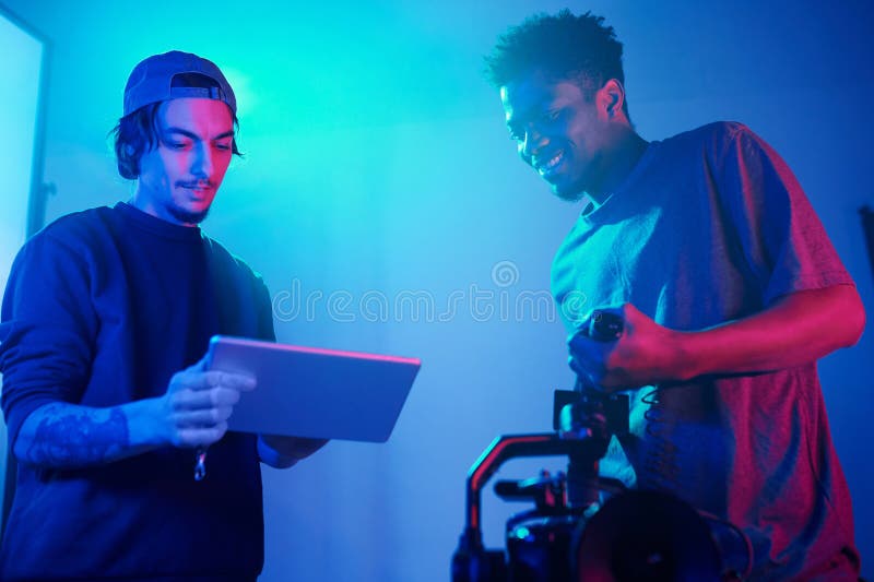 Camera Crew Using Tablet Pc during Shooting Stock Image - Image of ...
